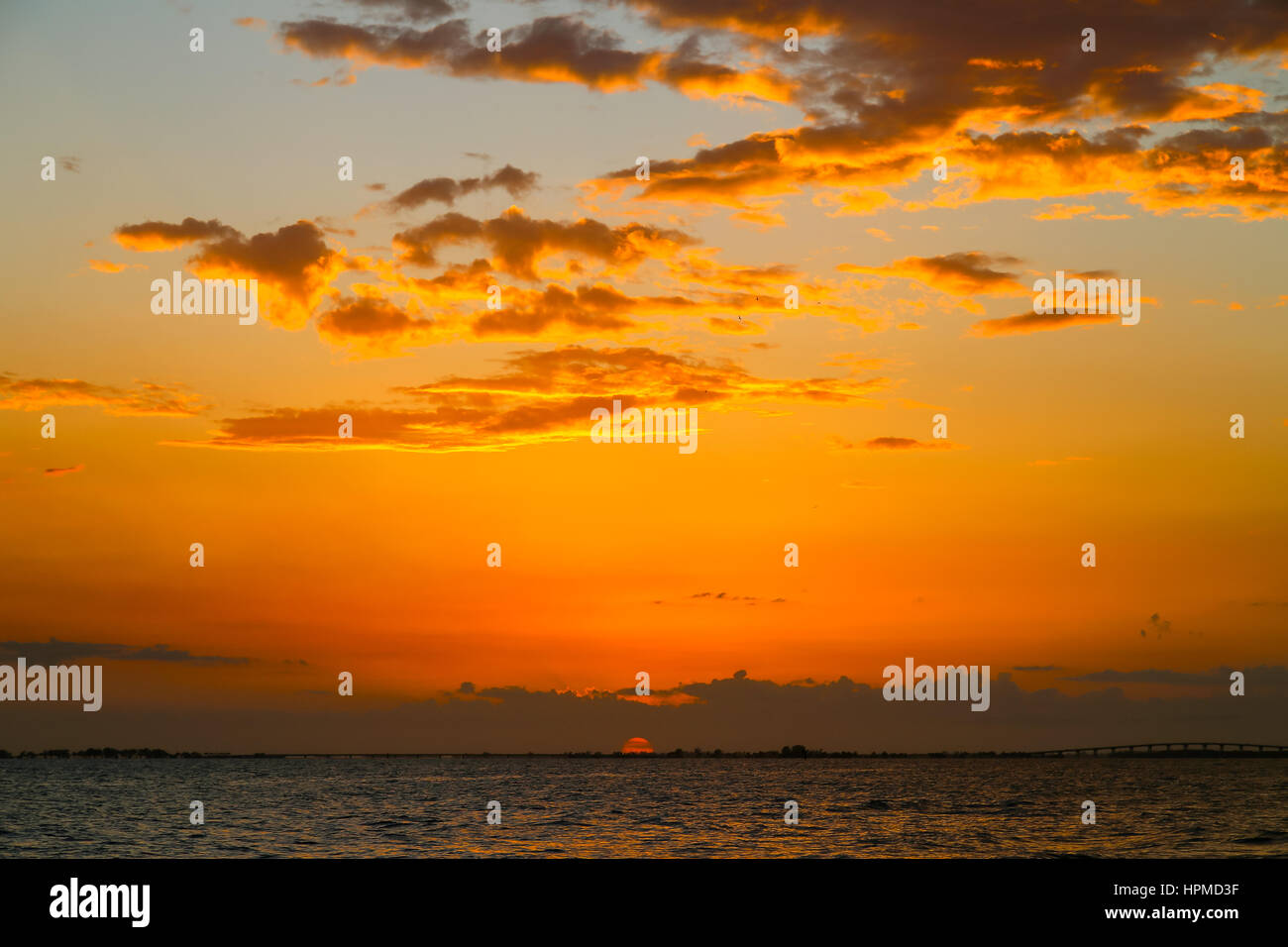 Tangerine sunset sky above the Gulf of Mexico in Fort Myers Beach with ...