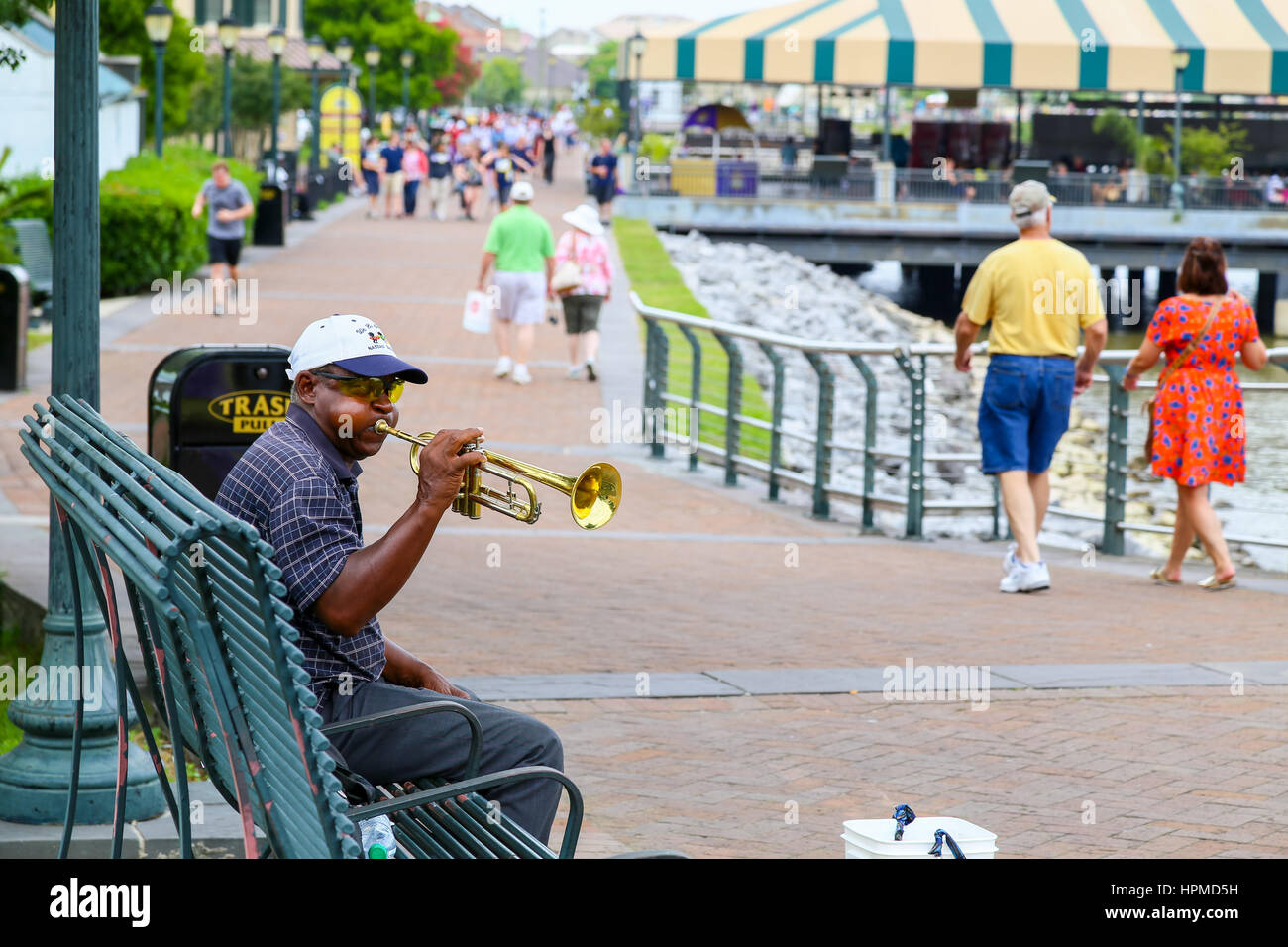 New Orleans, USA - May 14, 2015: Trumpeter sitting on a bench on the ...
