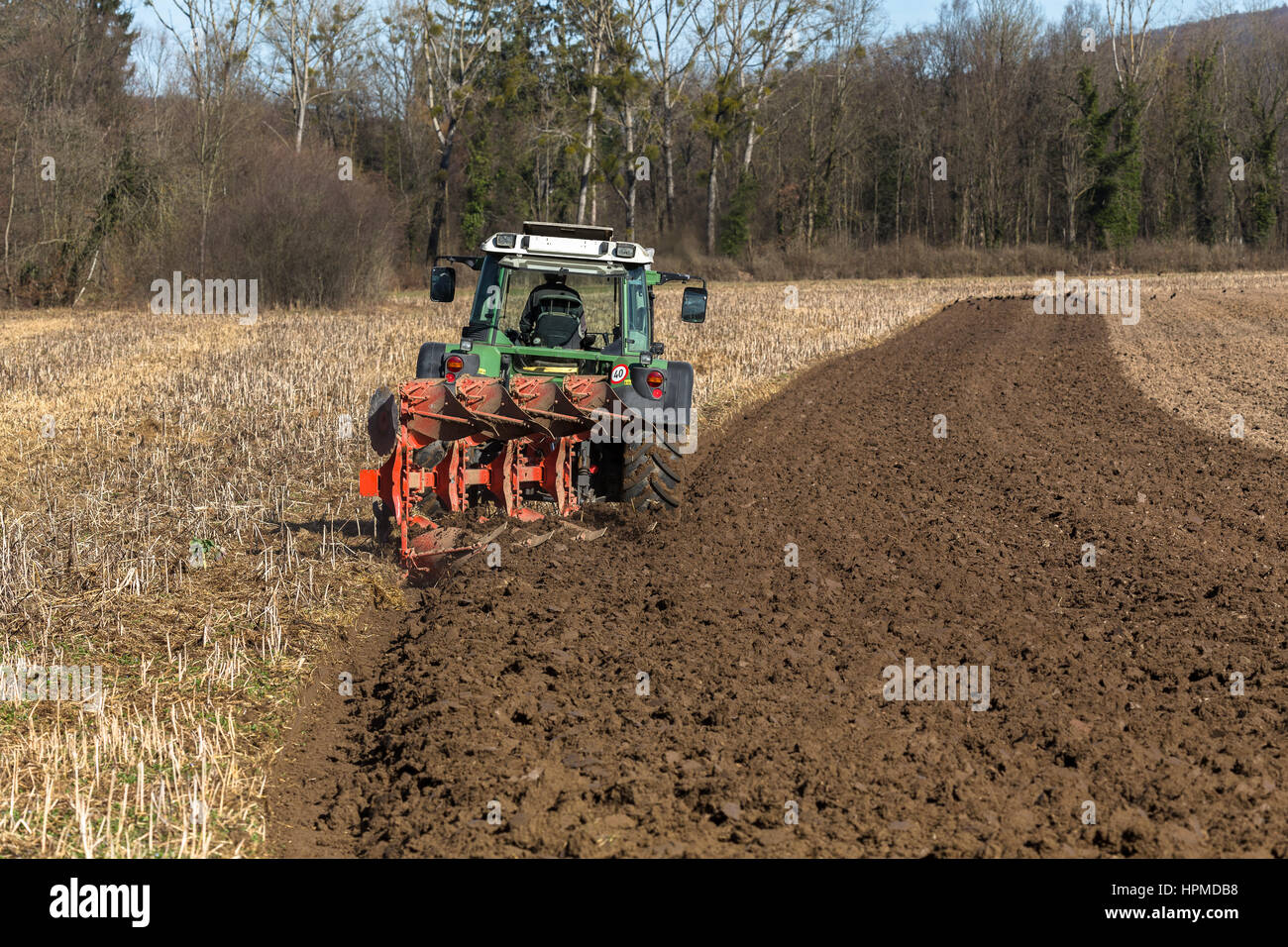 Farmer plowing the field at Lange Erlen, Basel, Switzerland Stock Photo ...