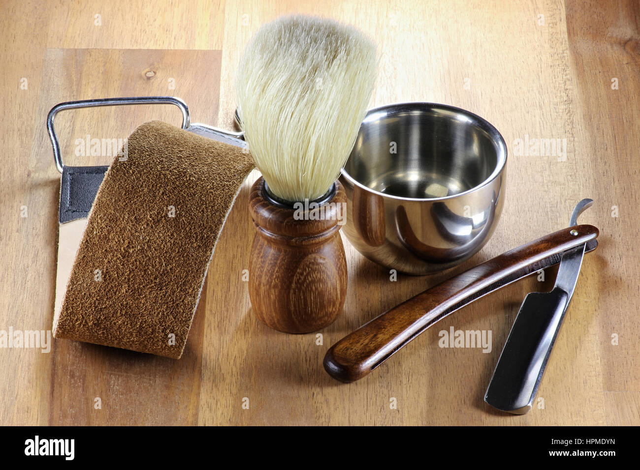 straight razor with accessories on wooden background Stock Photo - Alamy