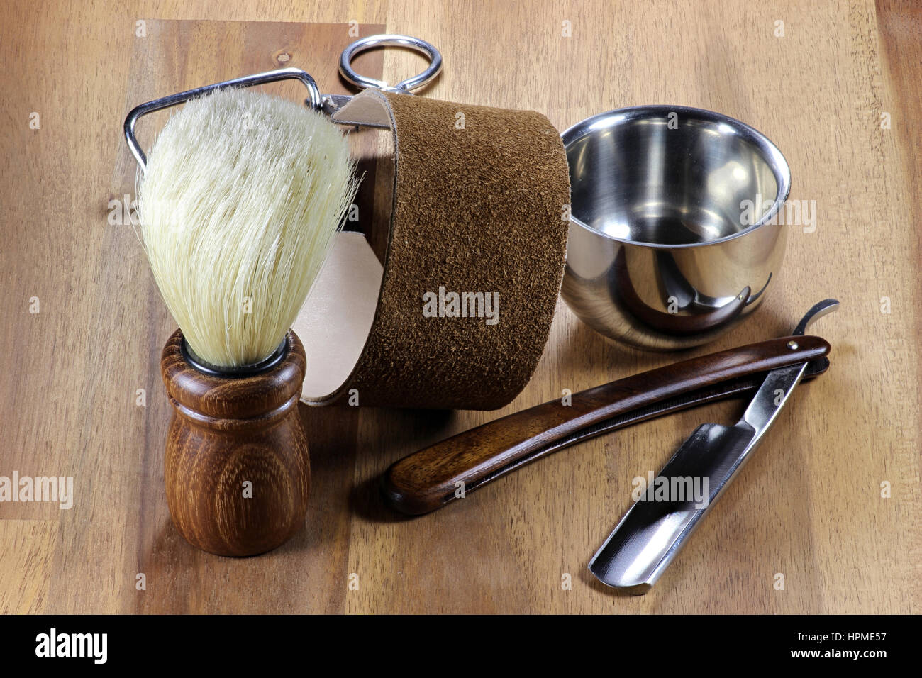 straight razor with accessories on wooden background Stock Photo - Alamy