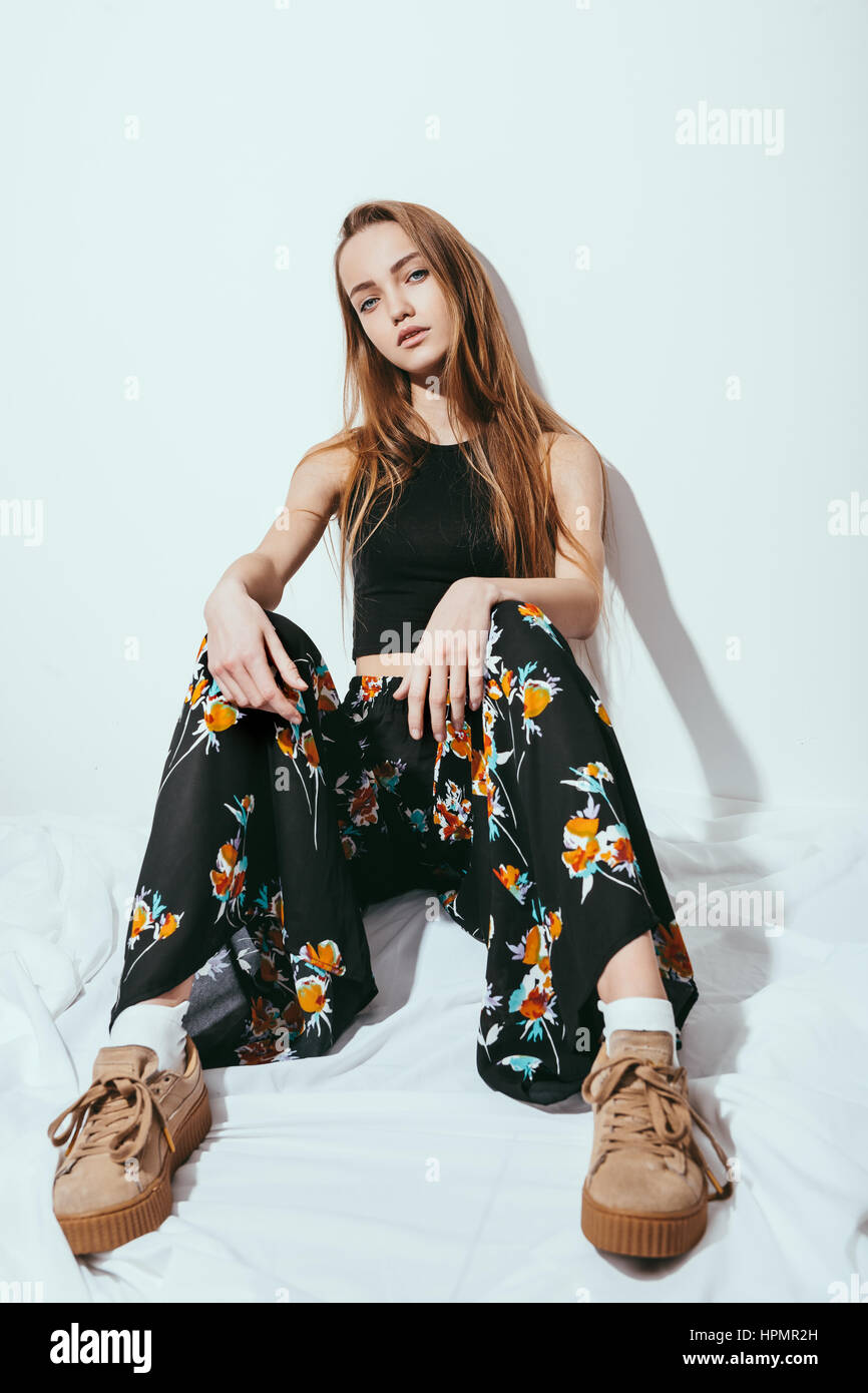 Fashion girl sitting on floor hi-res stock photography and images - Alamy