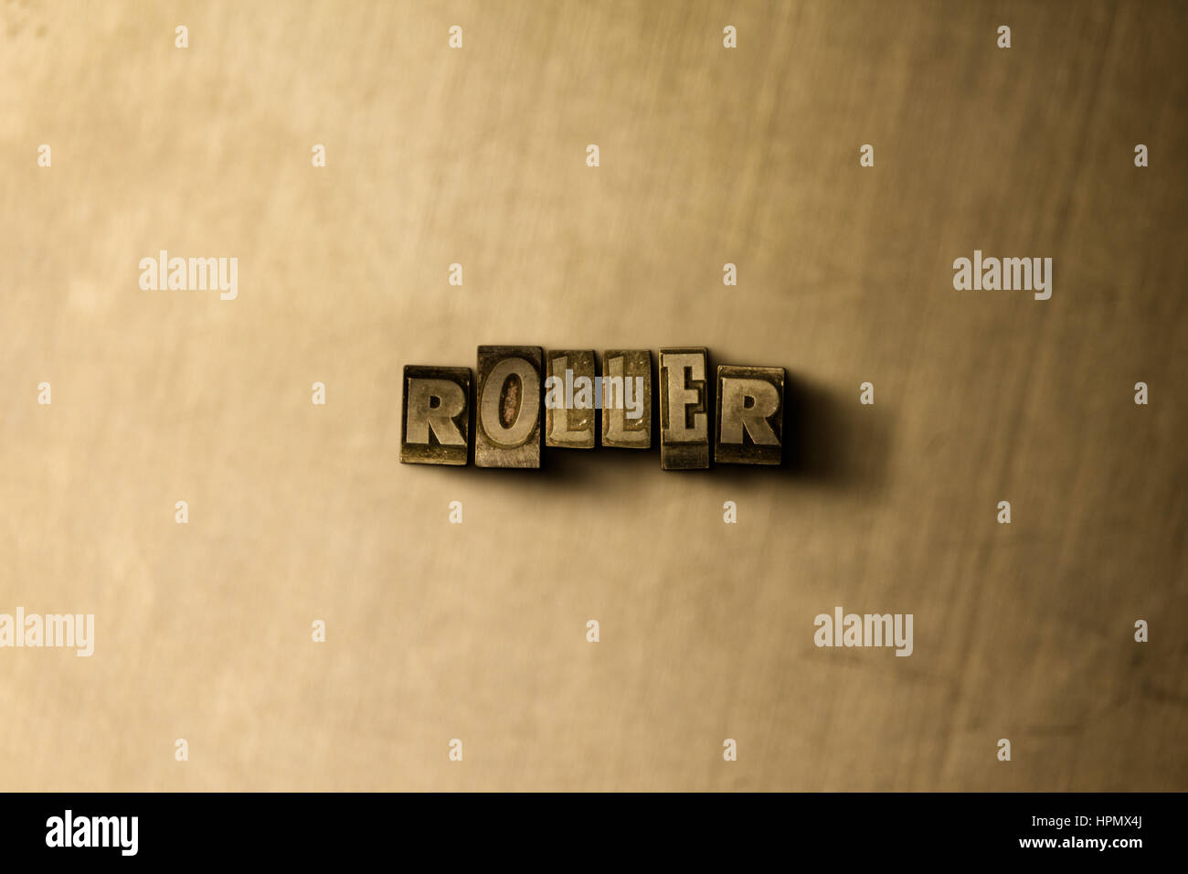 ROLLER - close-up of grungy vintage typeset word on metal backdrop ...