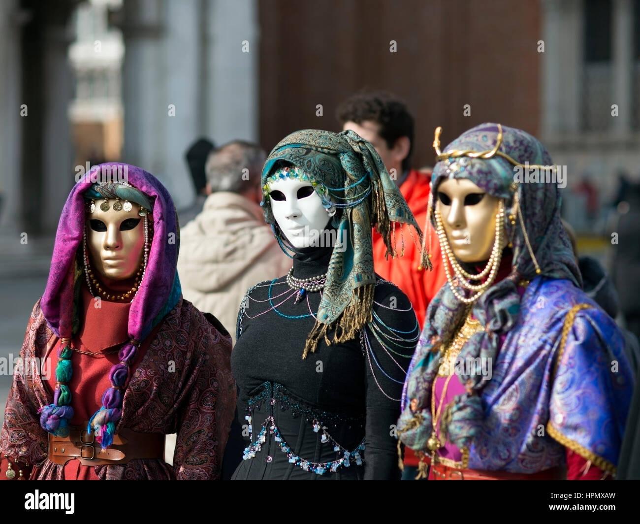 Women disguised in traditional costumes on St. Mark's square, Venice ...
