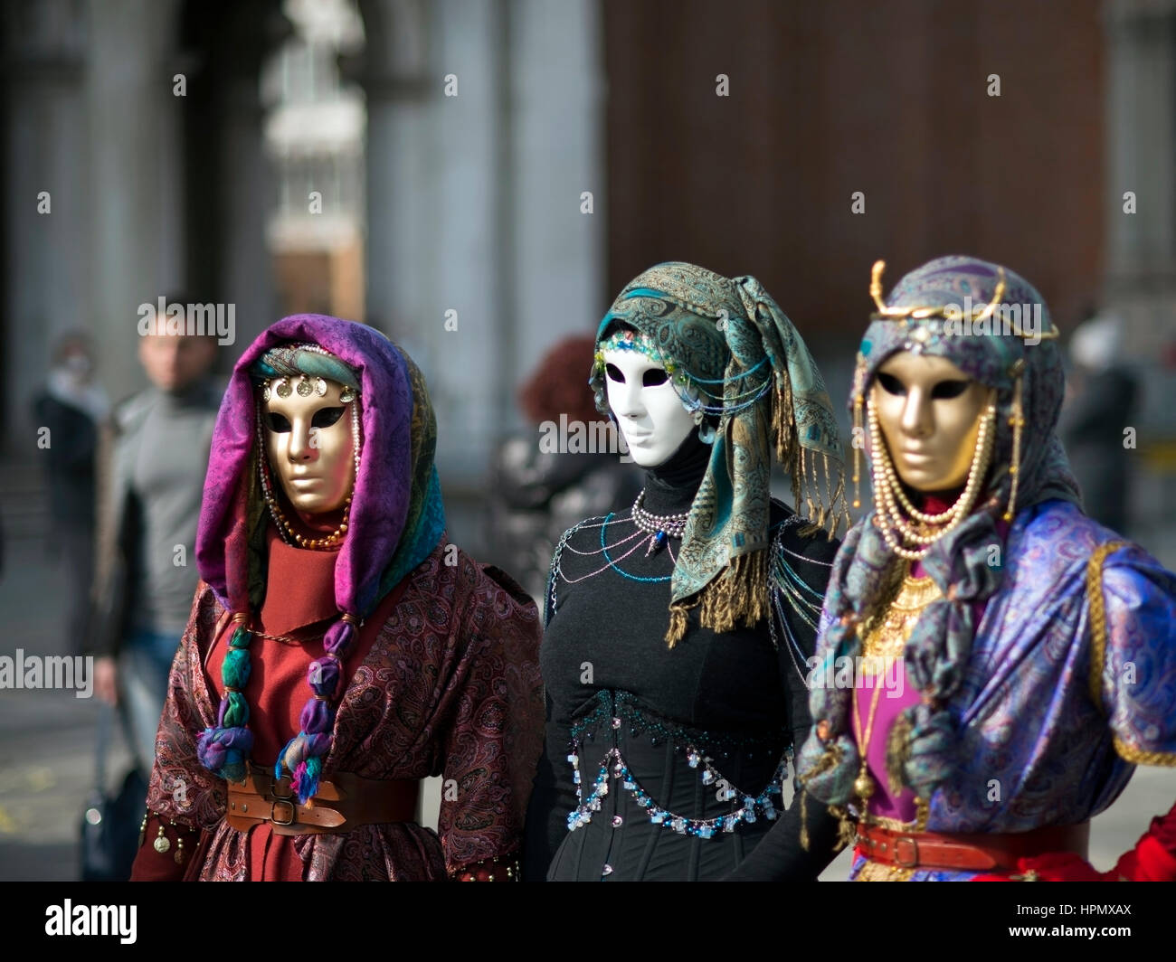 Women disguised in traditional costumes on St. Mark's square, Venice ...