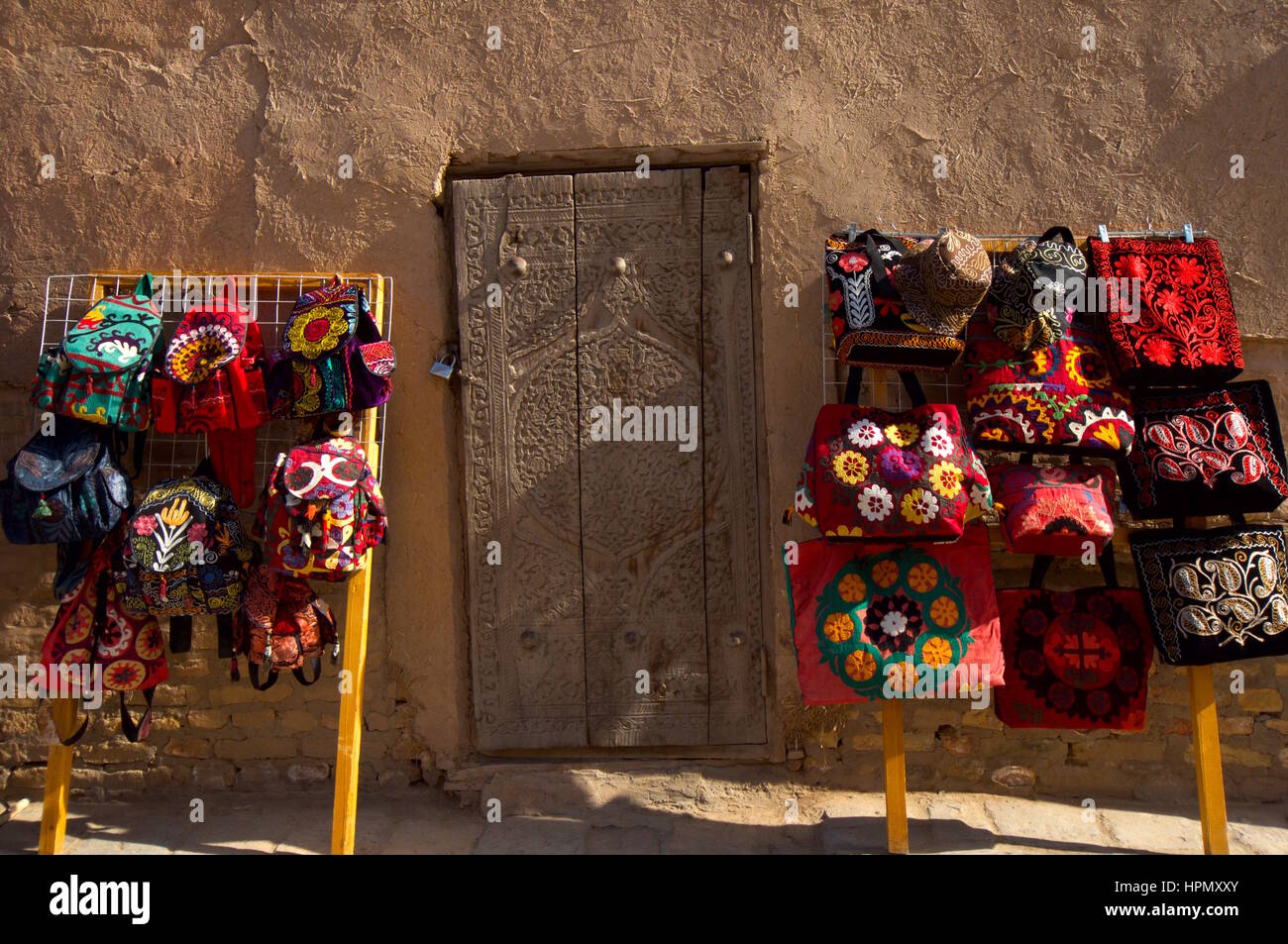 Colourful cloth bags with traditional embroidery displayed on both ...