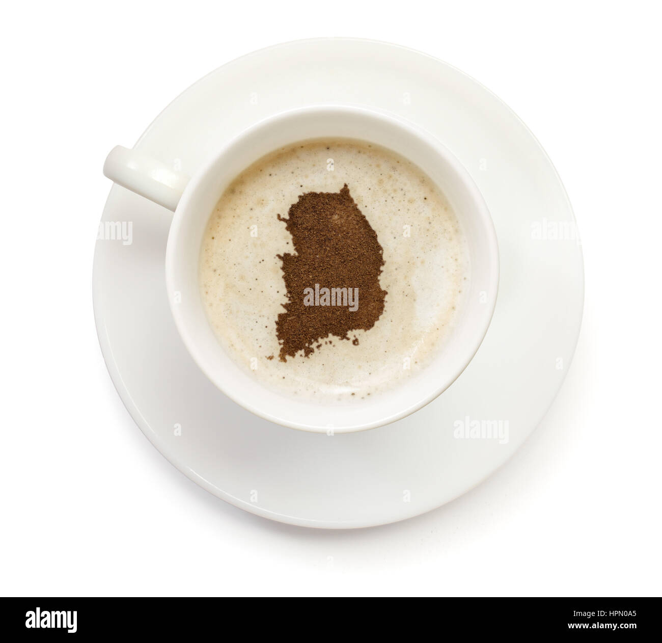 A cup of coffee with foam and powder in the shape of South Korea ...