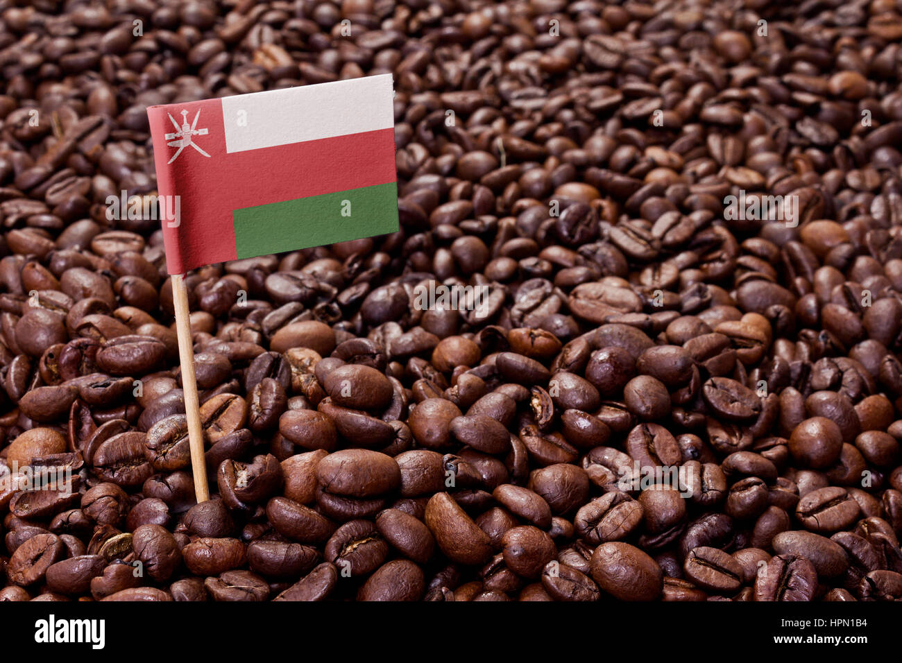Flag of Oman sticking in roasted coffee beans.(series Stock Photo - Alamy