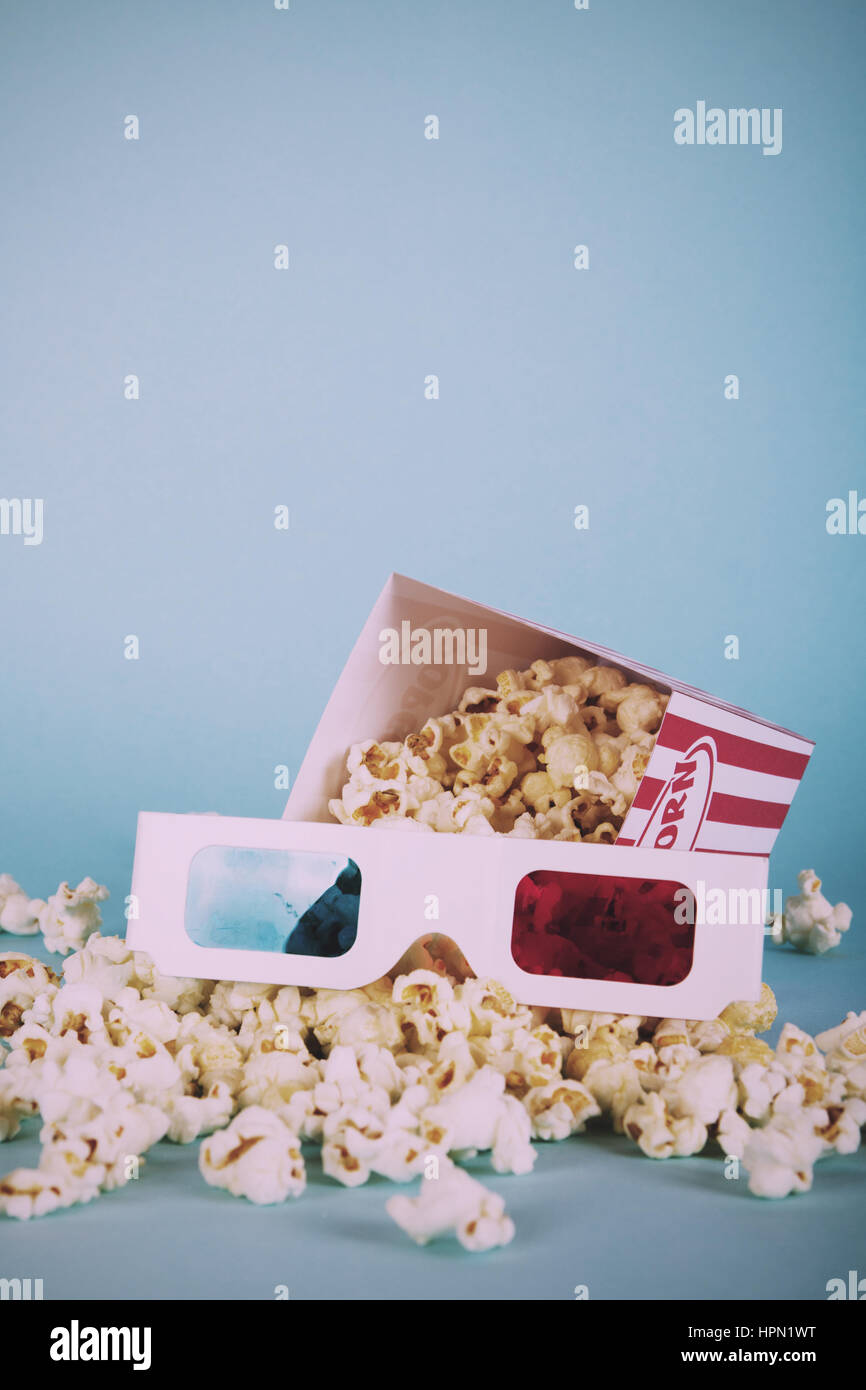 Bucket of popcorn against a blue background Vintage Retro Filter Stock ...