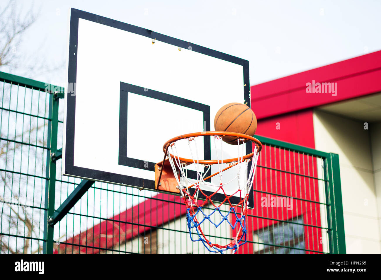 Basketball hoop outside in a school play area Stock Photo - Alamy