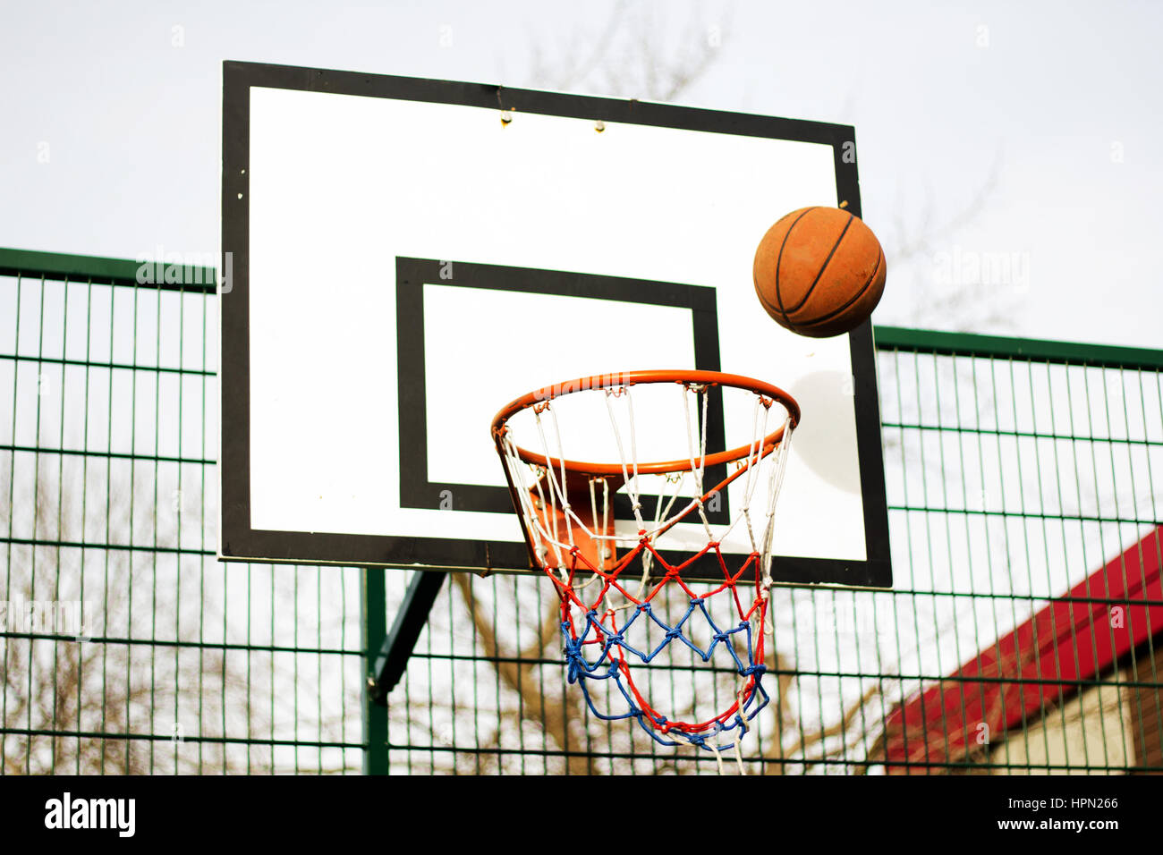 Basketball hoop outside in a school play area Stock Photo - Alamy