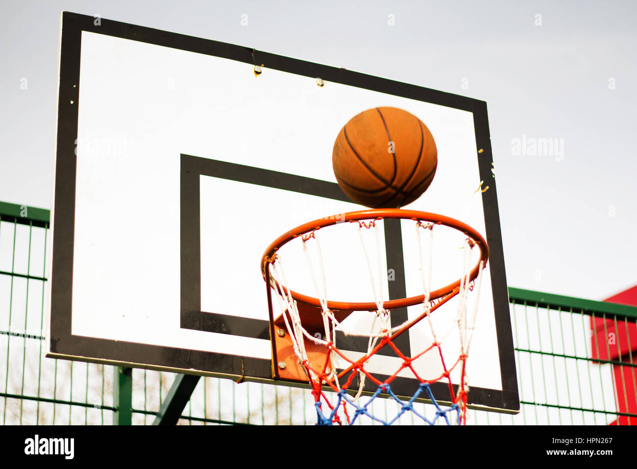 Basketball hoop outside in a school play area Stock Photo - Alamy