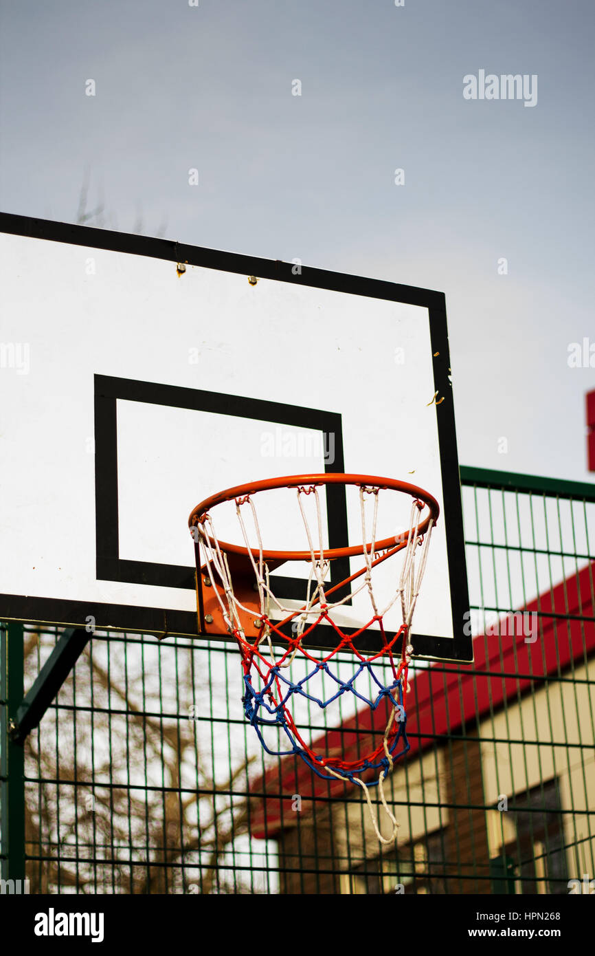 Basketball hoop outside in a school play area Stock Photo - Alamy
