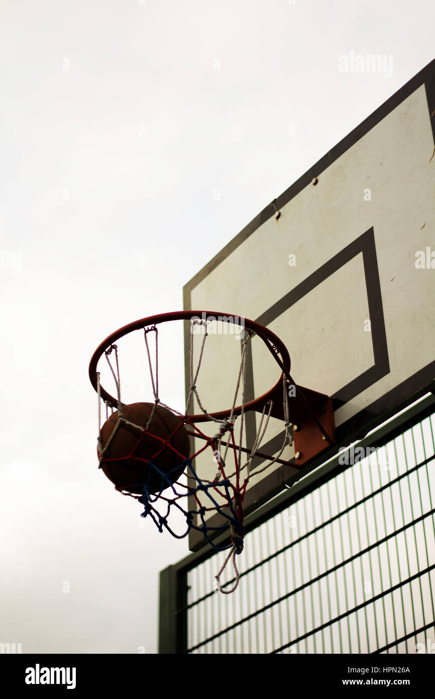 Basketball hoop outside in a school play area Stock Photo - Alamy
