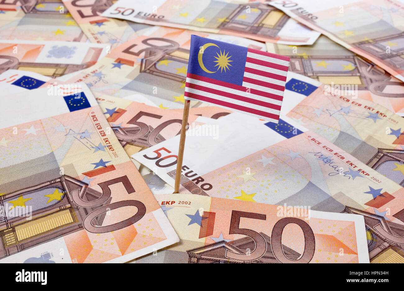 Flag of Malaysia sticking in european banknotes.(series Stock Photo - Alamy