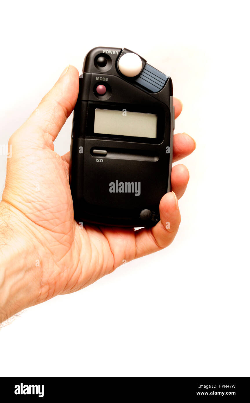 male hand holding a professional photographic light meter Stock Photo ...