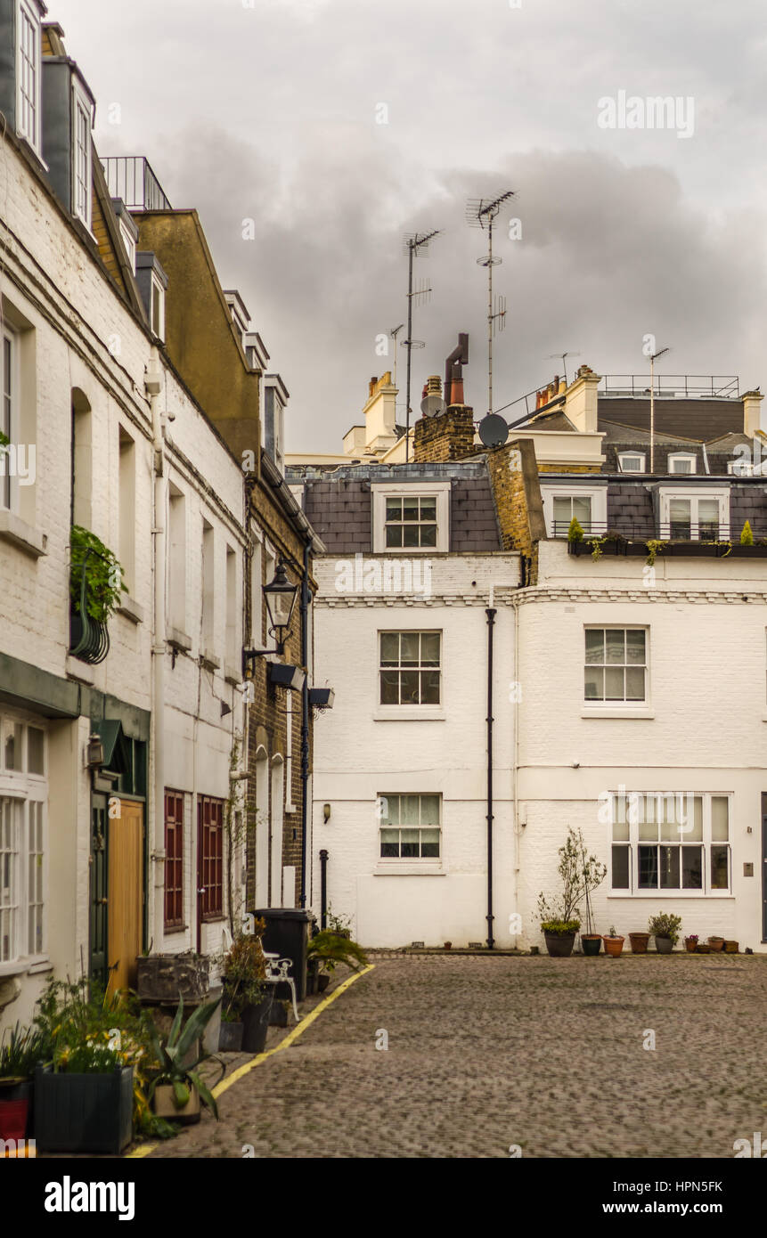 interesting street partially covered with paving stones, low-rise ...