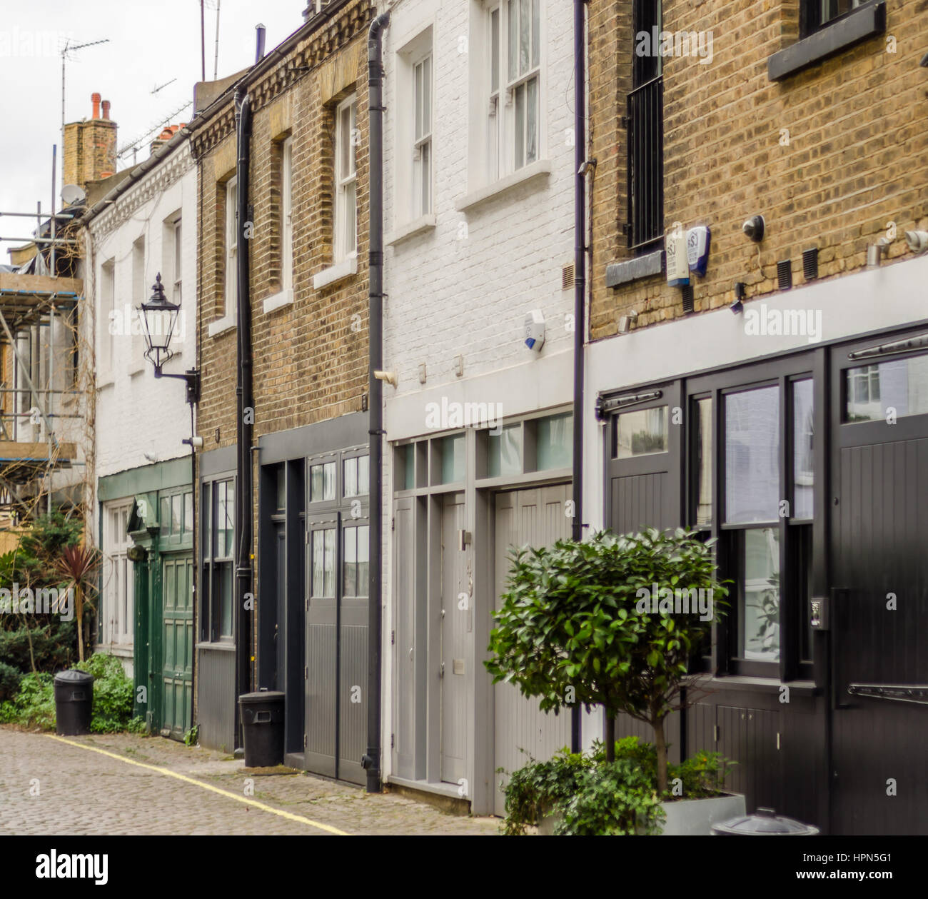 interesting street partially covered with paving stones, low-rise ...