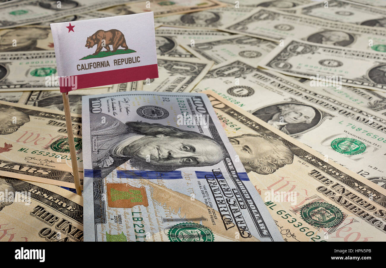 Flag of California sticking in a variety of american banknotes.(series ...