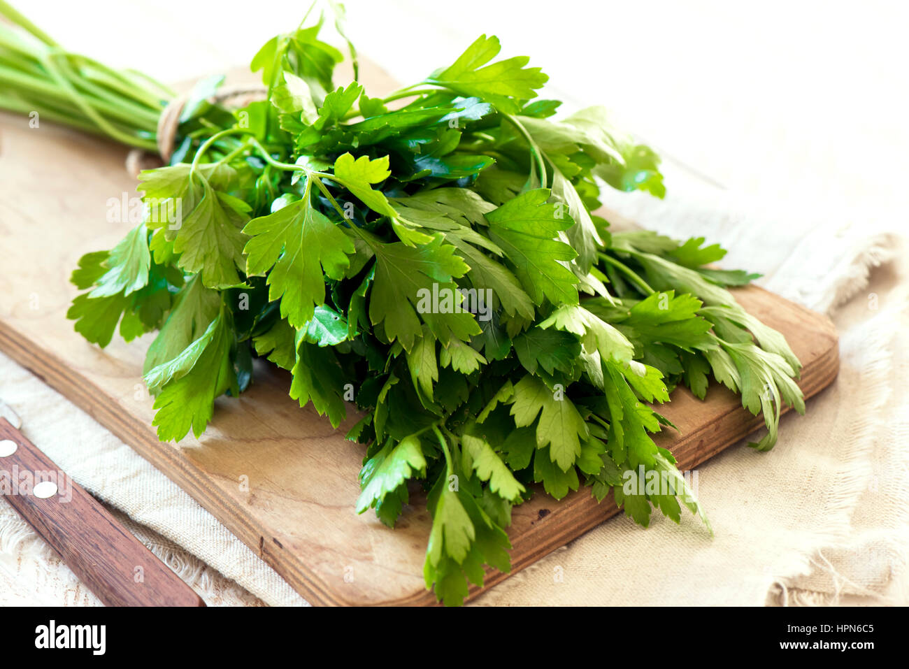 Organic italian parsley closeup on rustic wooden table, healthy ...
