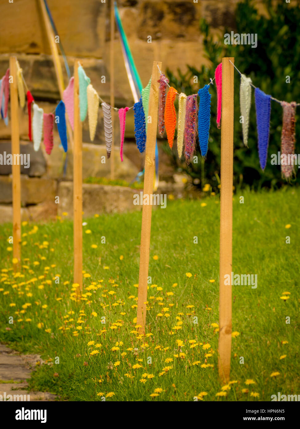 Colourful knitted bunting at St Mary's Church, Thirsk, UK Stock Photo ...