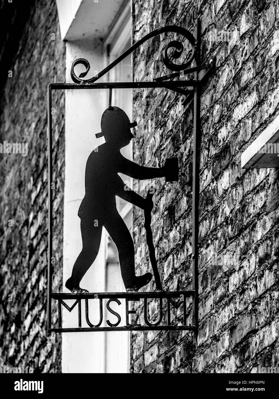 Metal museum sign on side of building, Thirsk, North Yorkshire, UK ...