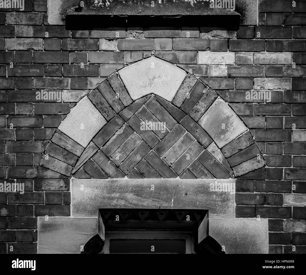 Ornate brickwork detail above window of building, Thirsk, North ...
