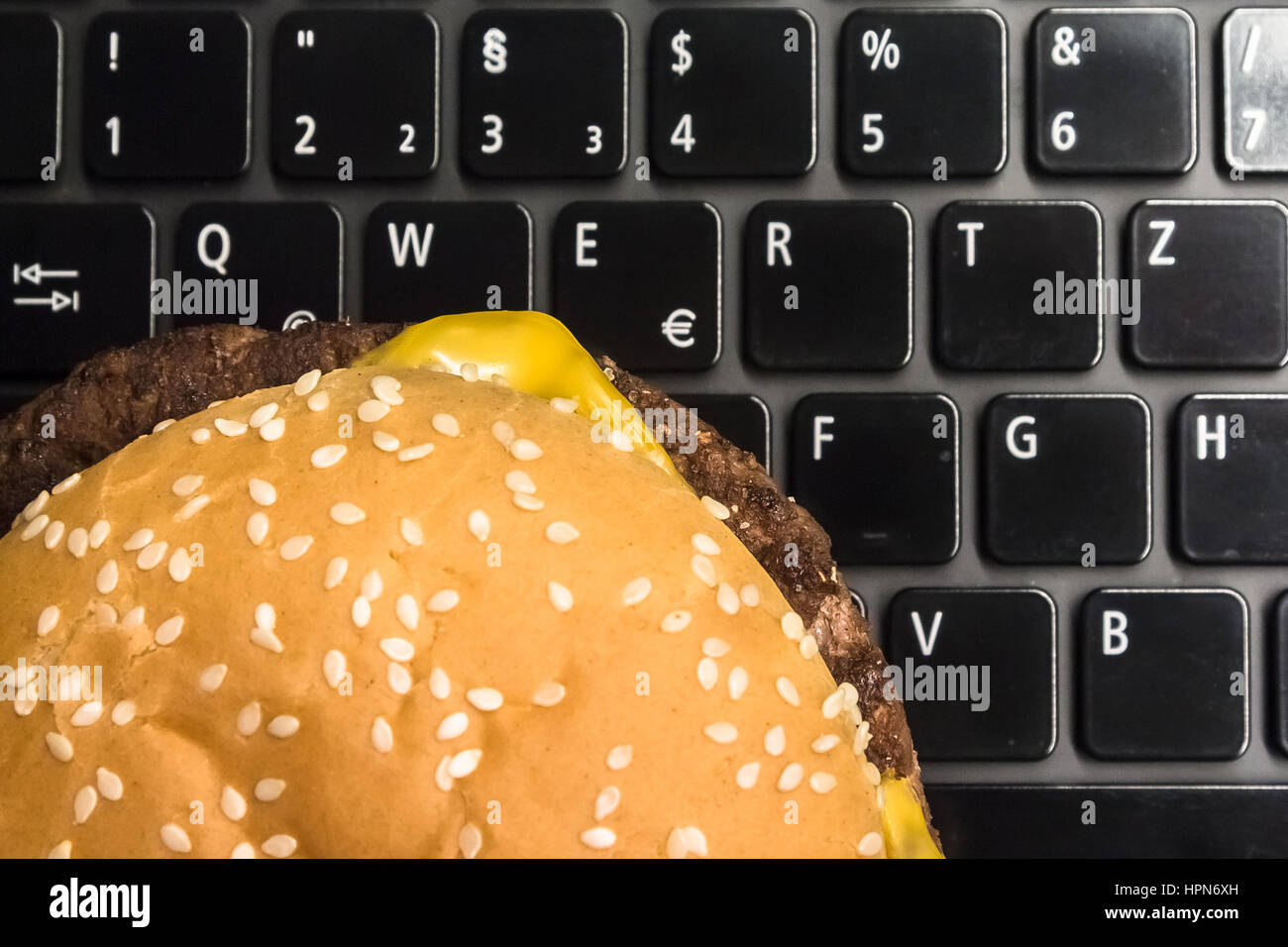 Cheeseburger on Laptop Keyboard - a Fast Food Lunch in the Workplace ...