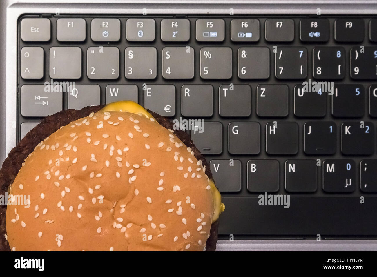 Cheeseburger on Laptop Keyboard - a Fast Food Lunch in the Workplace ...