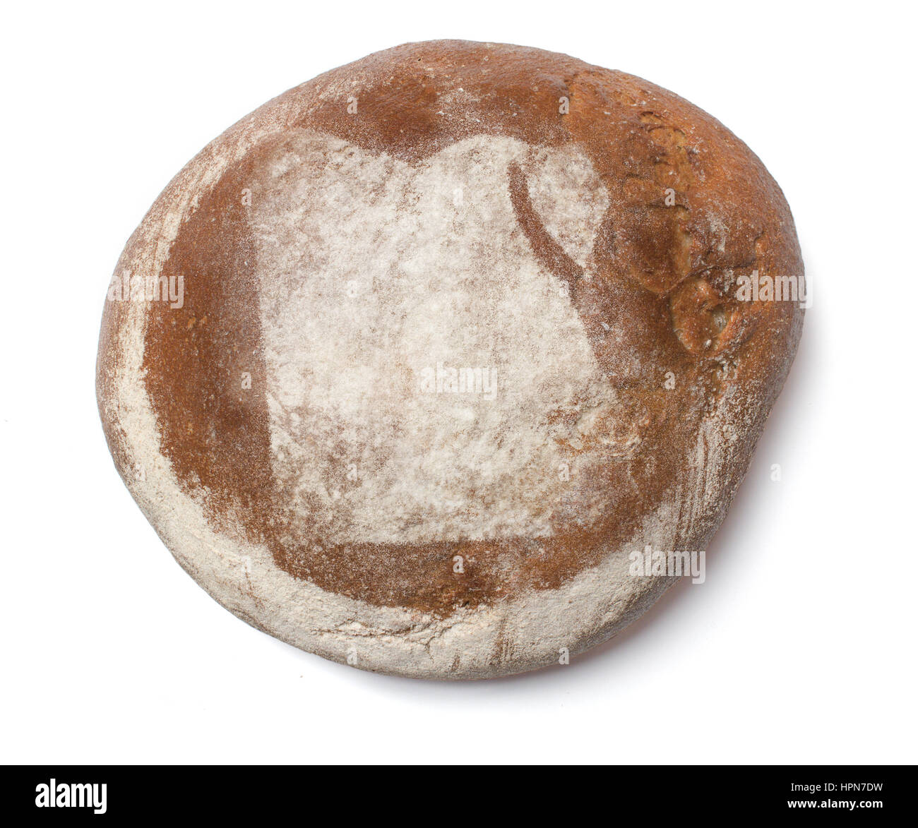 A freshly baked loaf of bread covered with rye flour in the shape of ...