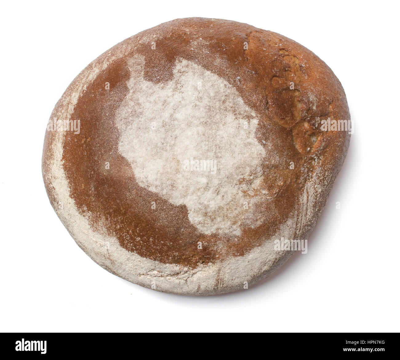 A freshly baked loaf of bread covered with rye flour in the shape of ...