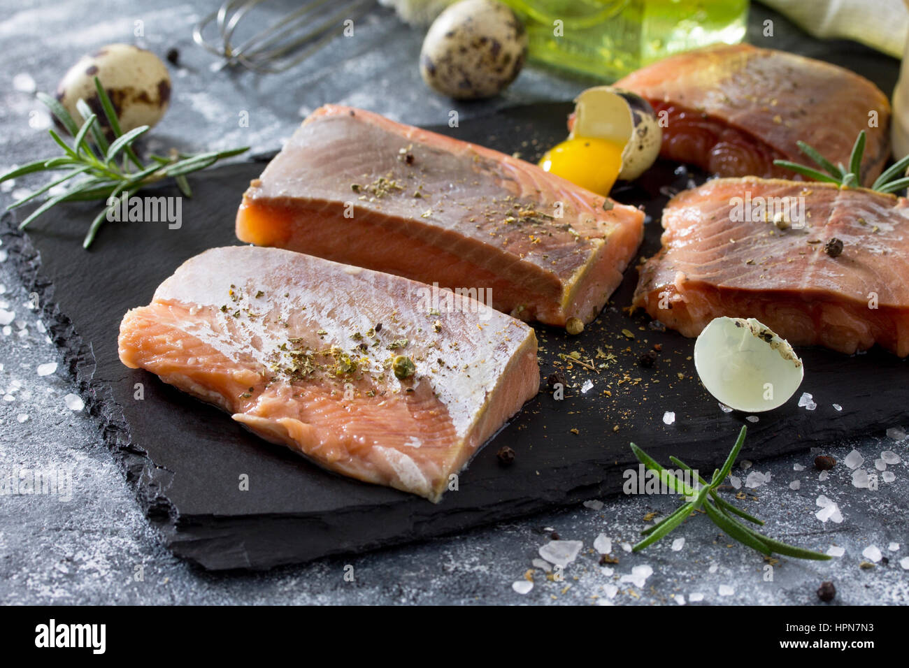 Ingredients for cooking egg omelet stuffed with red fish fillet. The ...