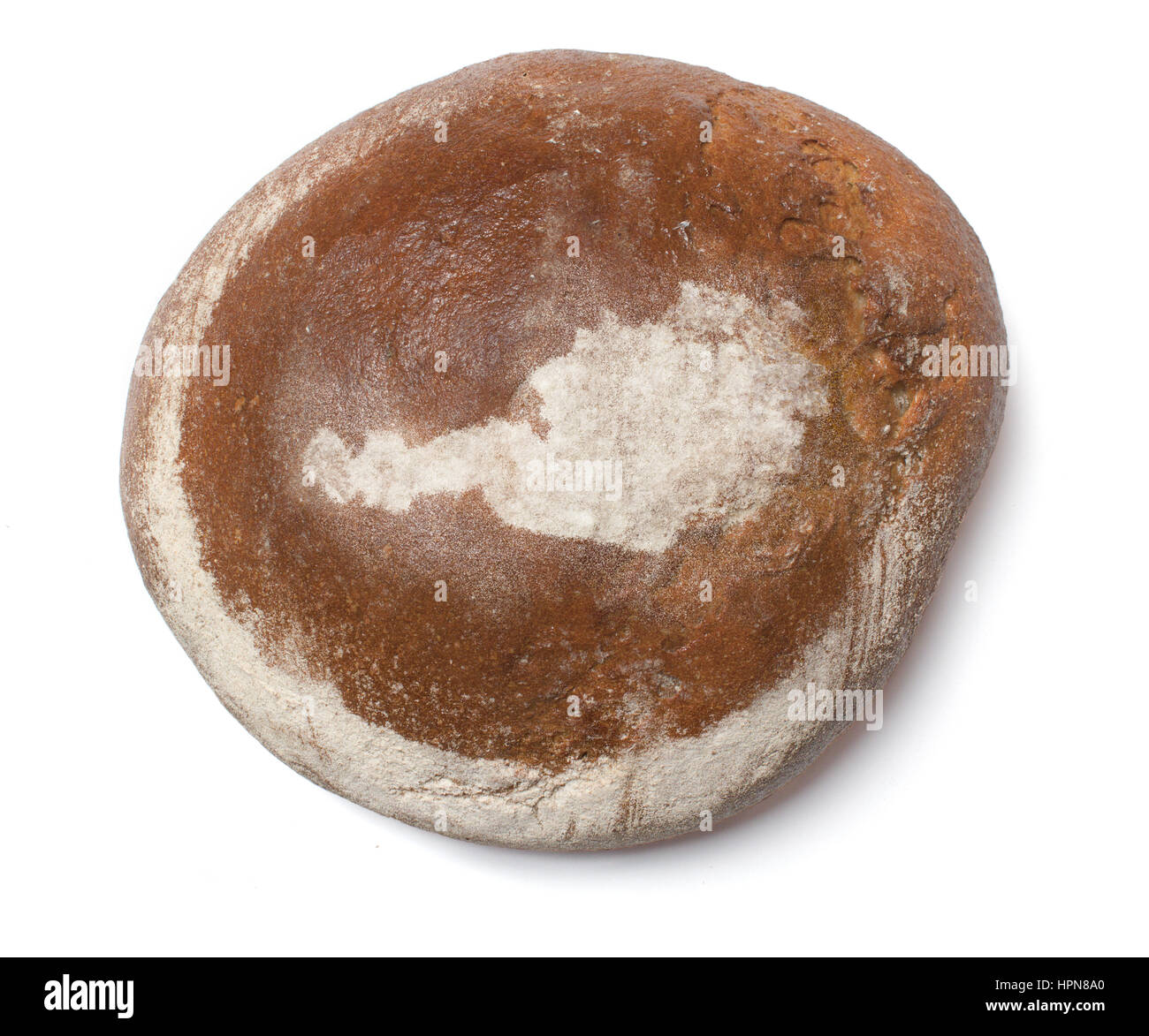 A freshly baked loaf of bread covered with rye flour in the shape of ...