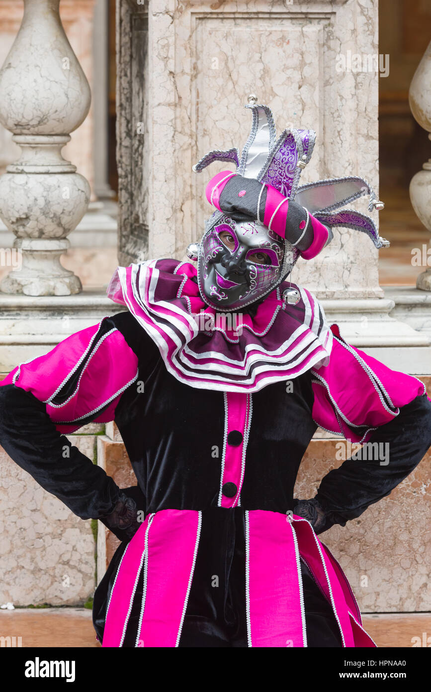A woman is seen outside the Doge's Palace wearing a traditional Volto ...
