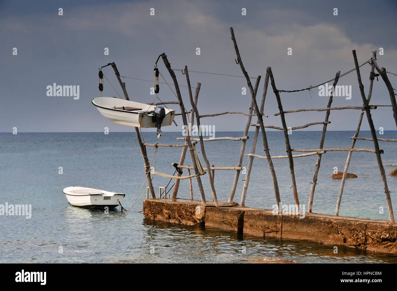 Hanging boats of Savudrija Boats hanging from traditional wooden cranes ...