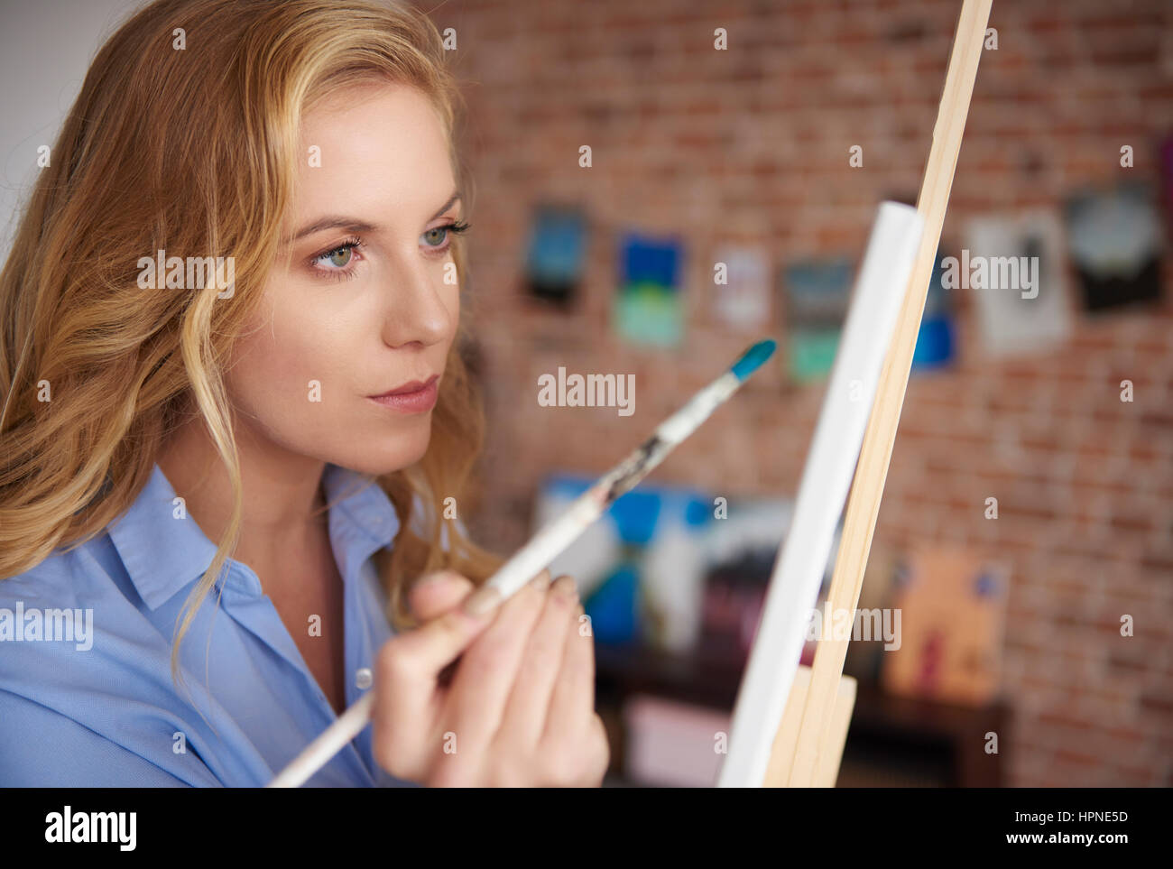 Young artist working on painting hi-res stock photography and images ...