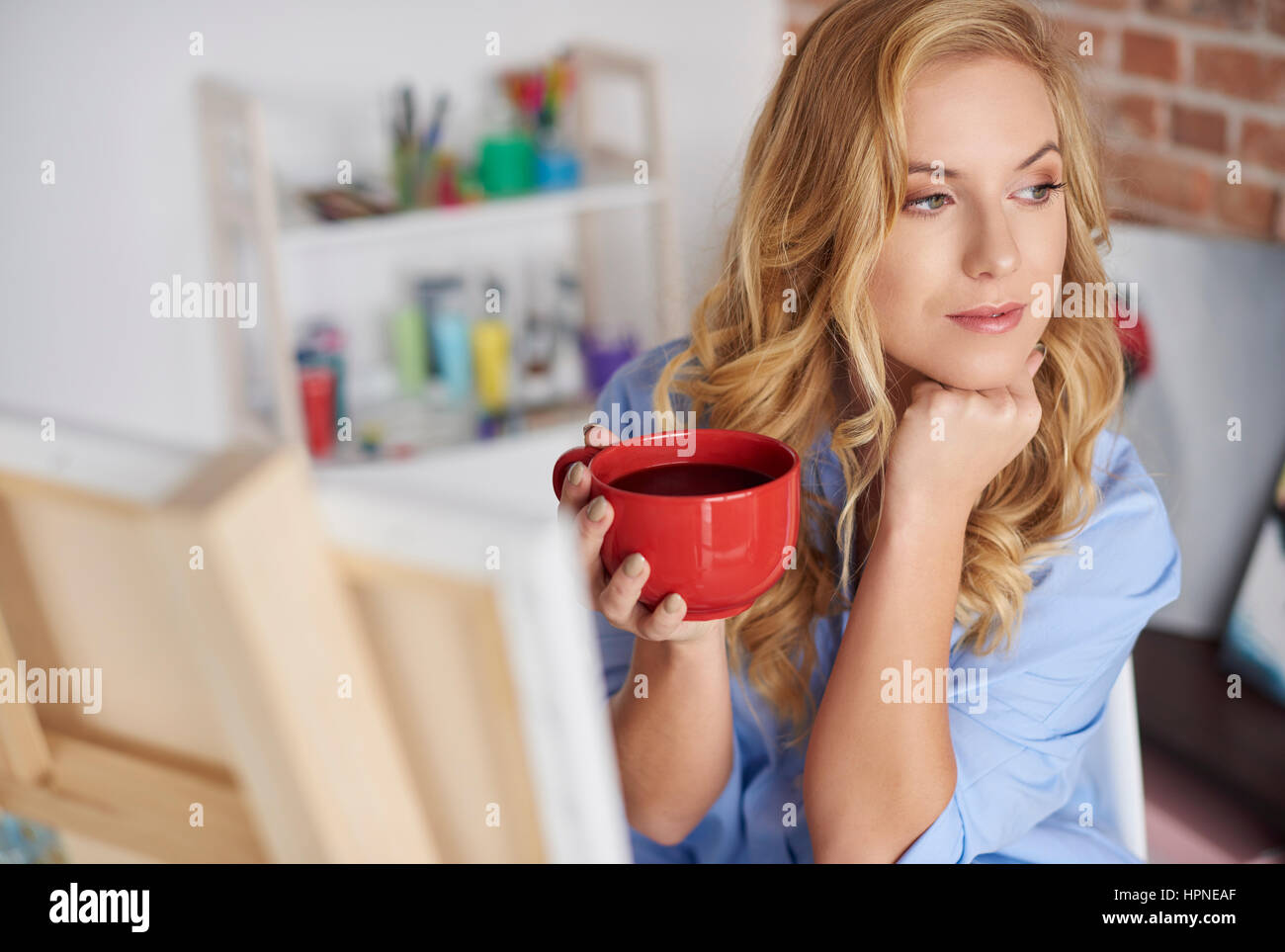 Drinking coffee while having a break Stock Photo - Alamy