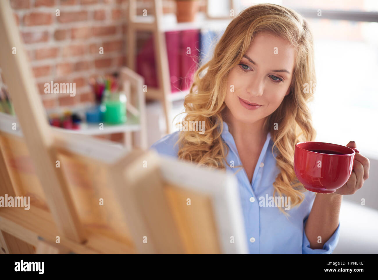 Female painter working in her workshop Stock Photo - Alamy