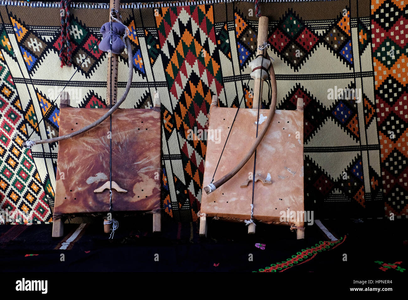 Two traditional Bedouin spike fiddles called Rababa or Rebab, covered ...