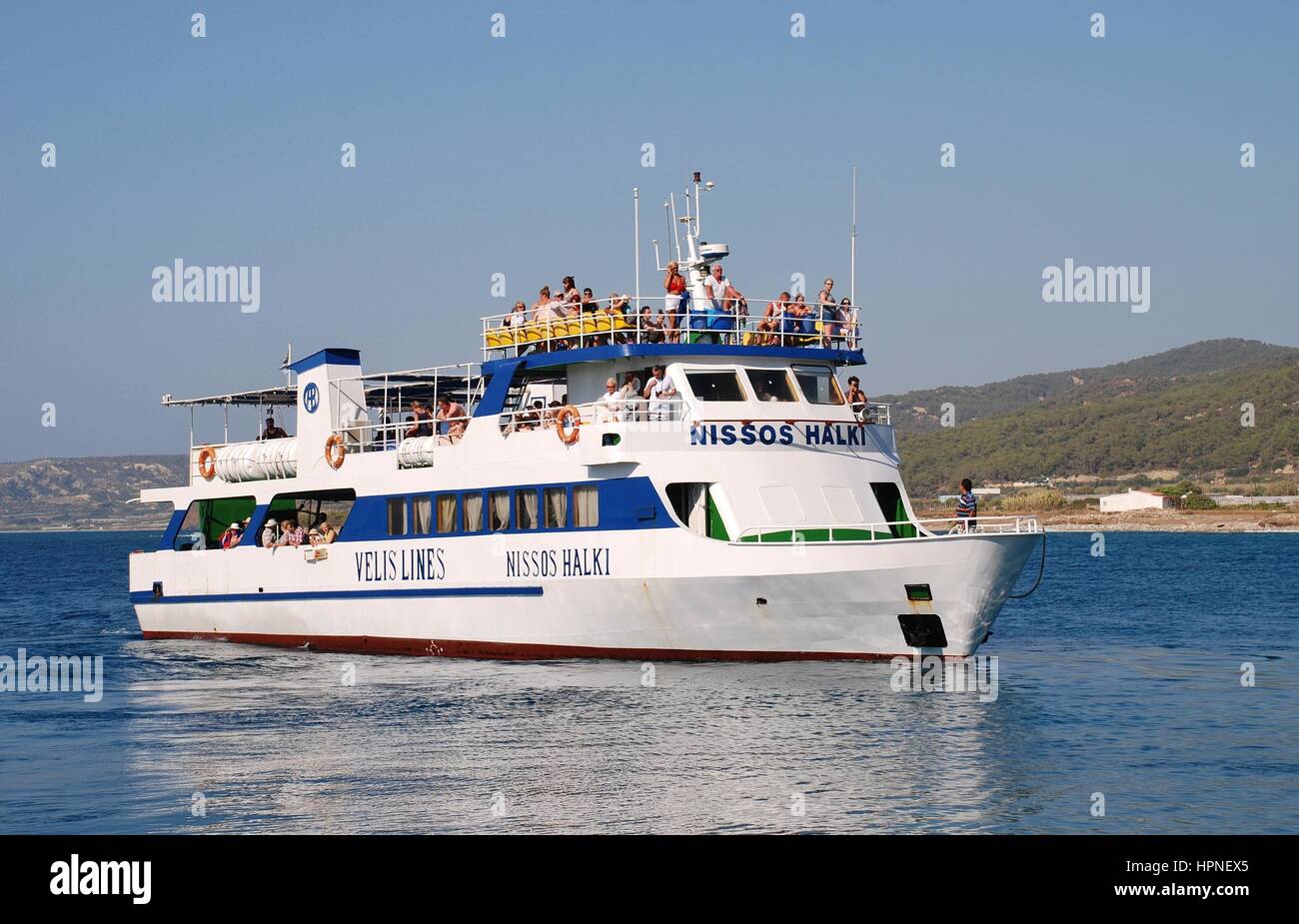 Ferry boat Nissos Halki arrives at Kamiros Skala port on the Greek ...