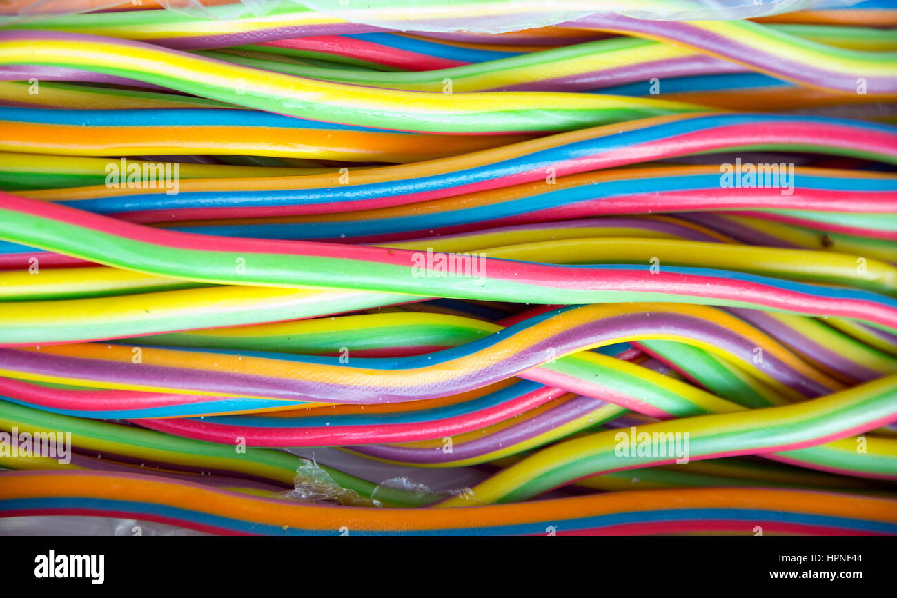 Homemade twisted colorful twisted licorice candies as a background ...