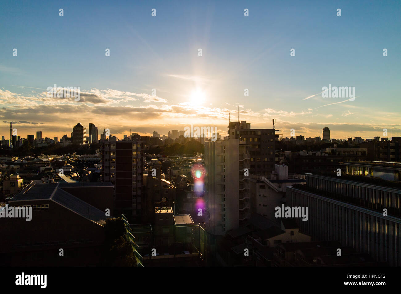 The Tokyo skyline as the sun starts to set, as seen from a tall ...
