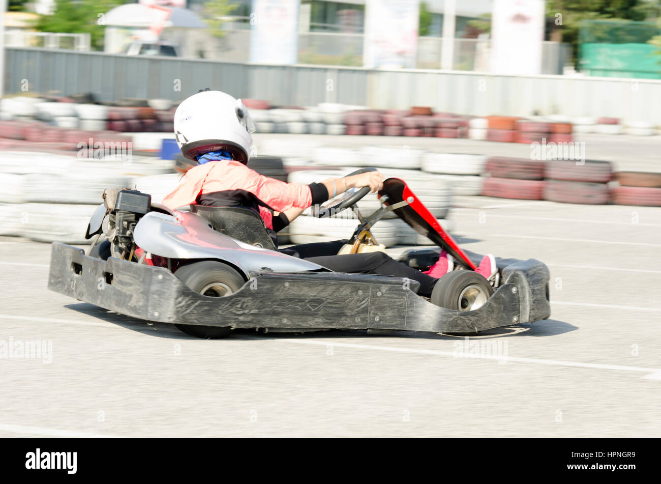 Karting driver motion blued Stock Photo - Alamy
