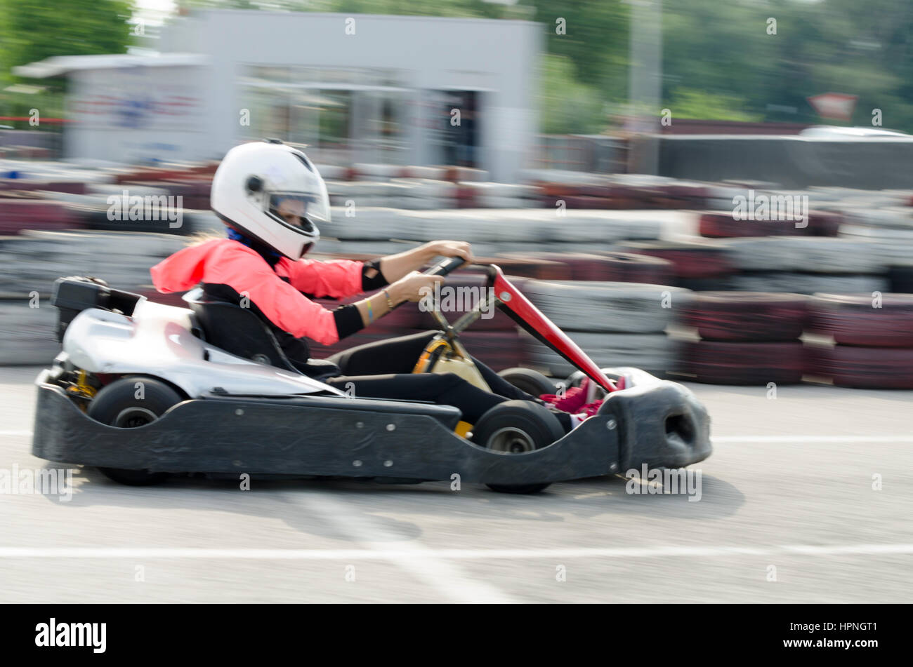 Karting driver motion blued Stock Photo - Alamy
