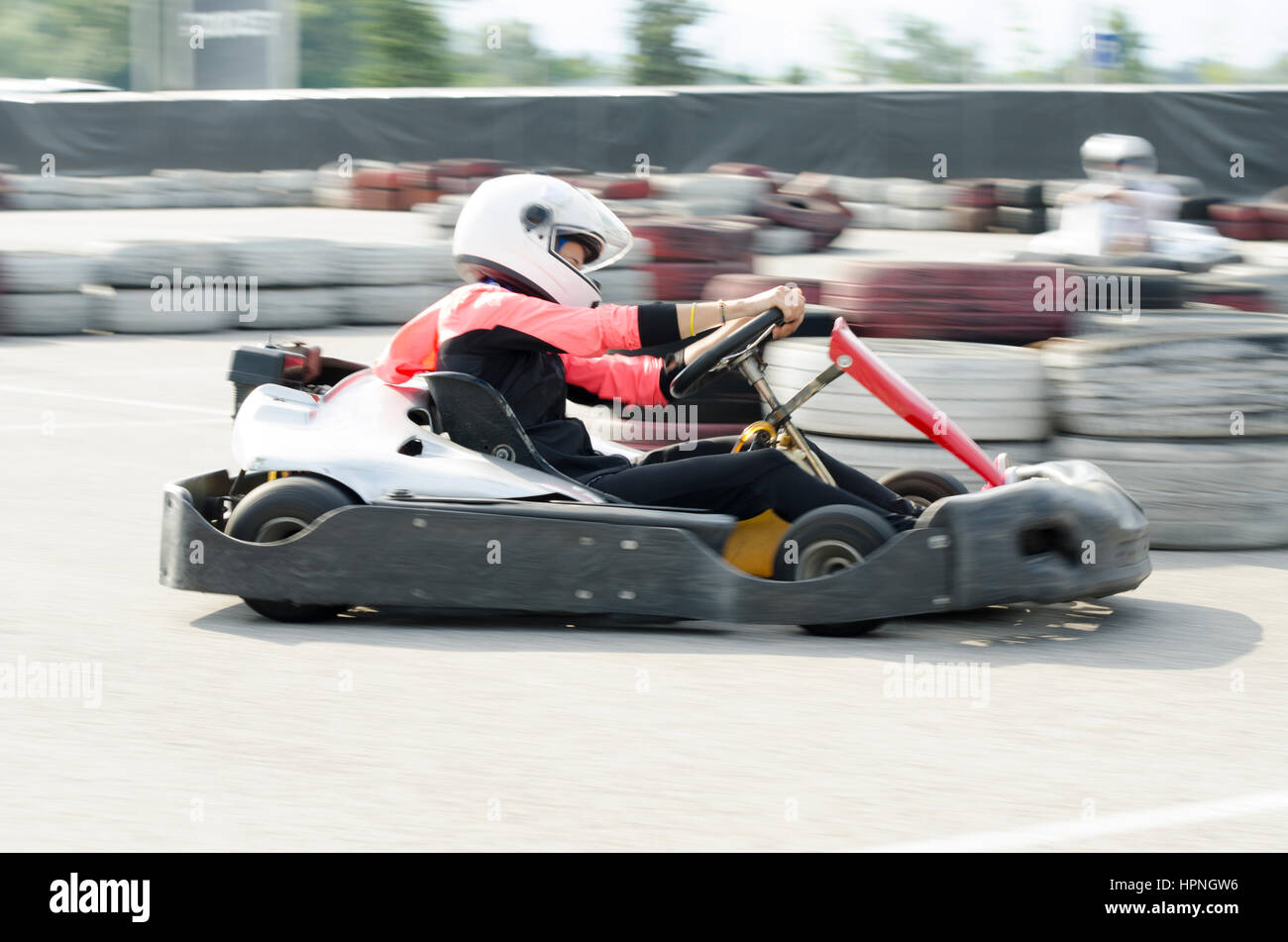 Karting driver motion blued Stock Photo - Alamy