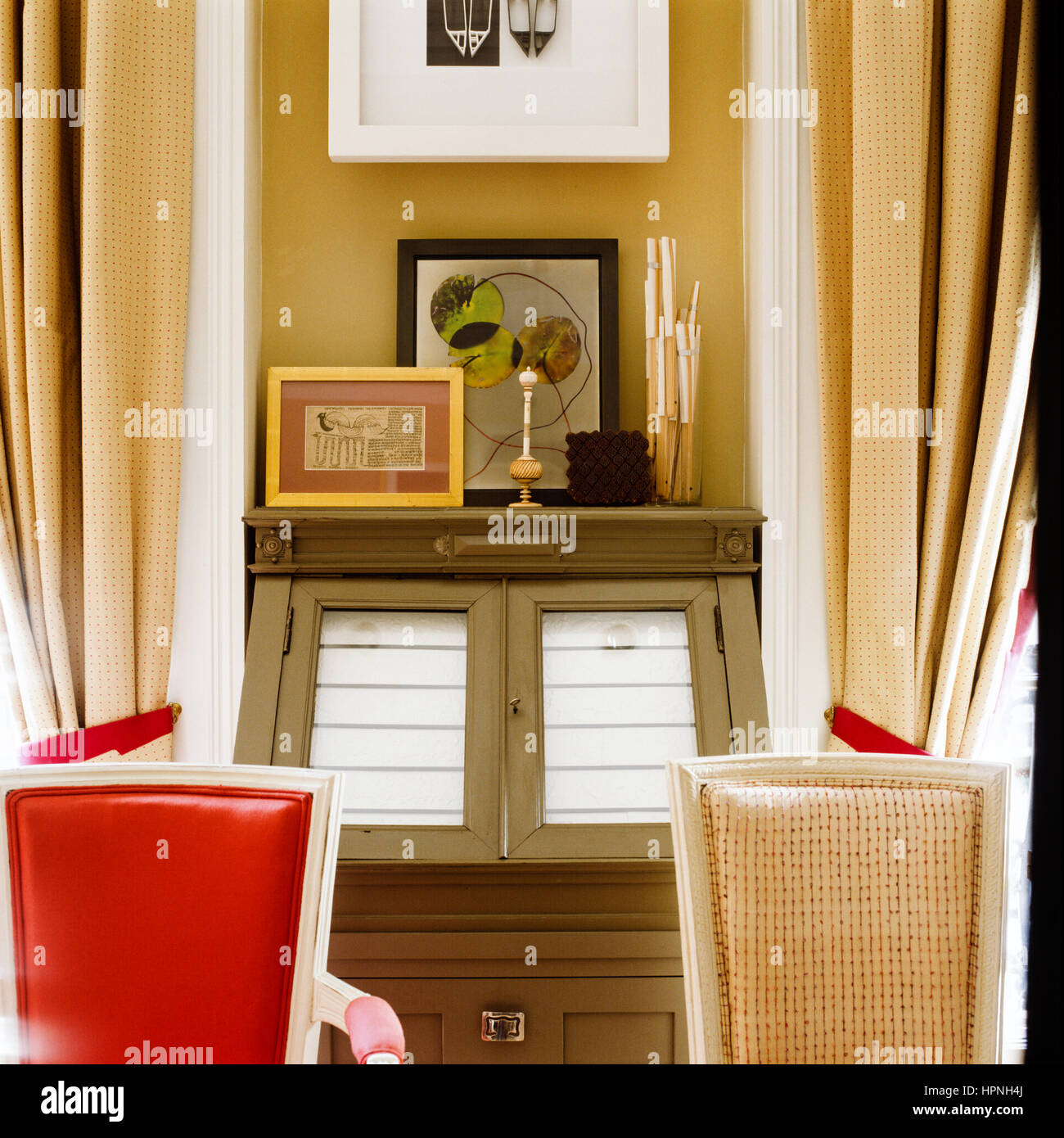 Two chairs in front of a cabinet Stock Photo - Alamy