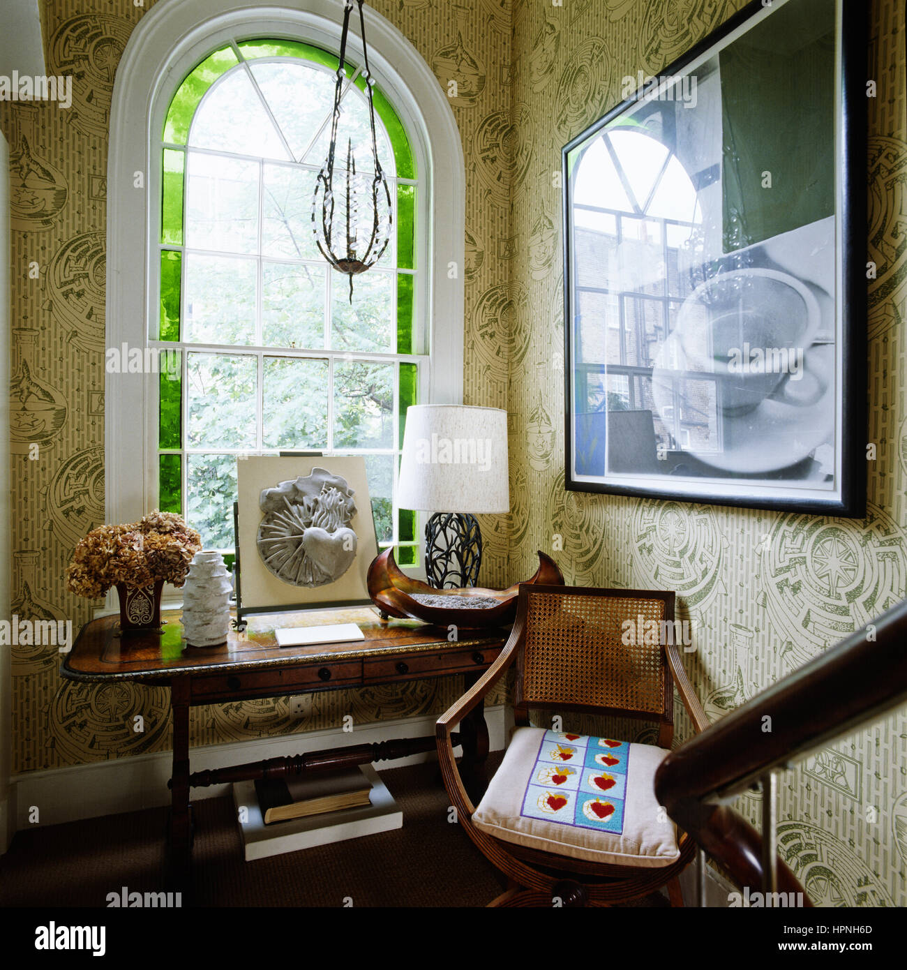 A desk and chair by a window Stock Photo - Alamy