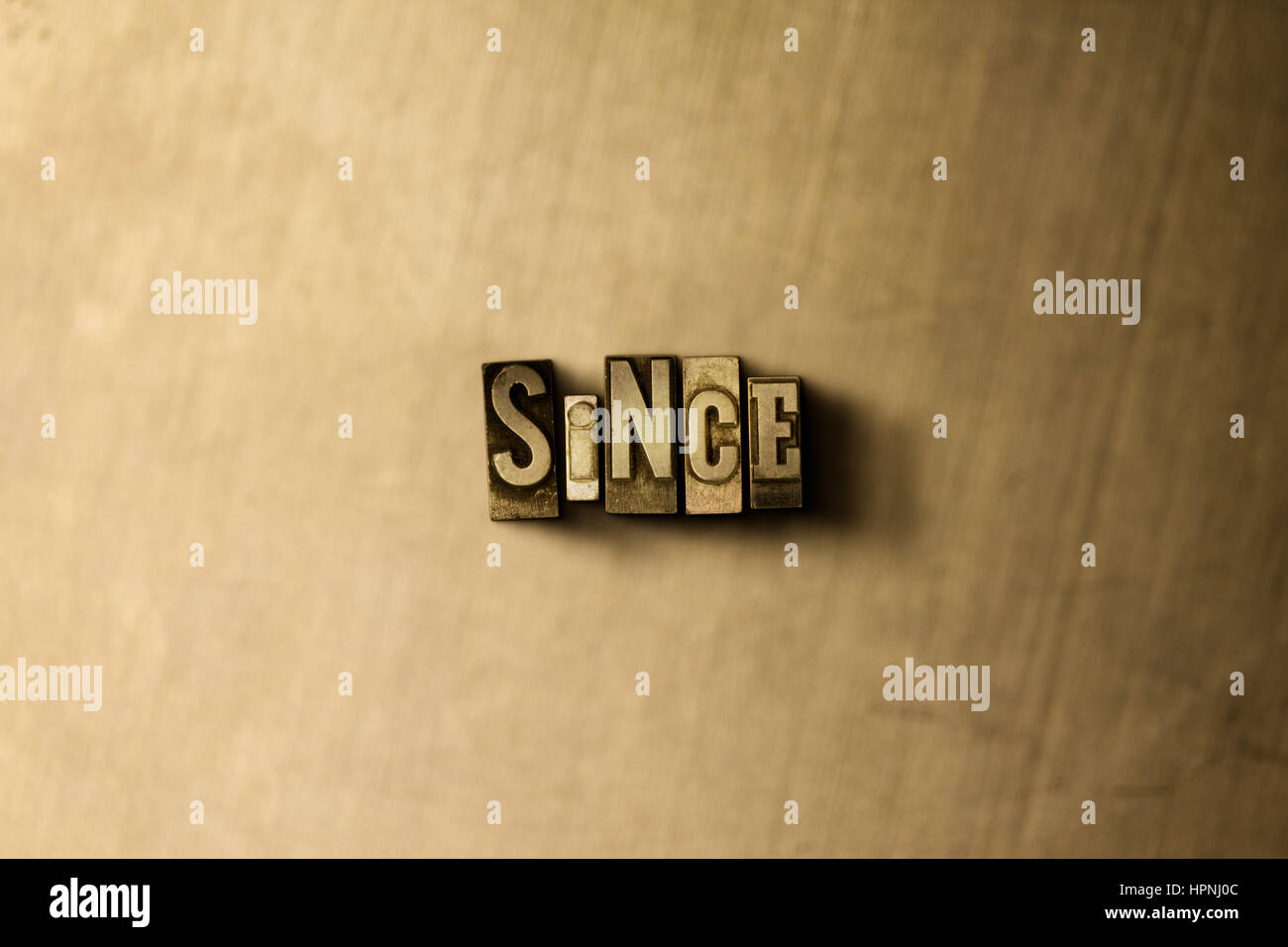 SINCE - close-up of grungy vintage typeset word on metal backdrop ...