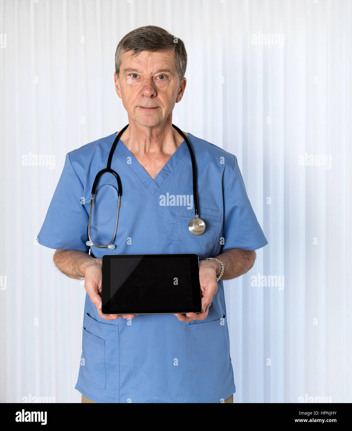 Doctor holding ipad hi-res stock photography and images - Alamy