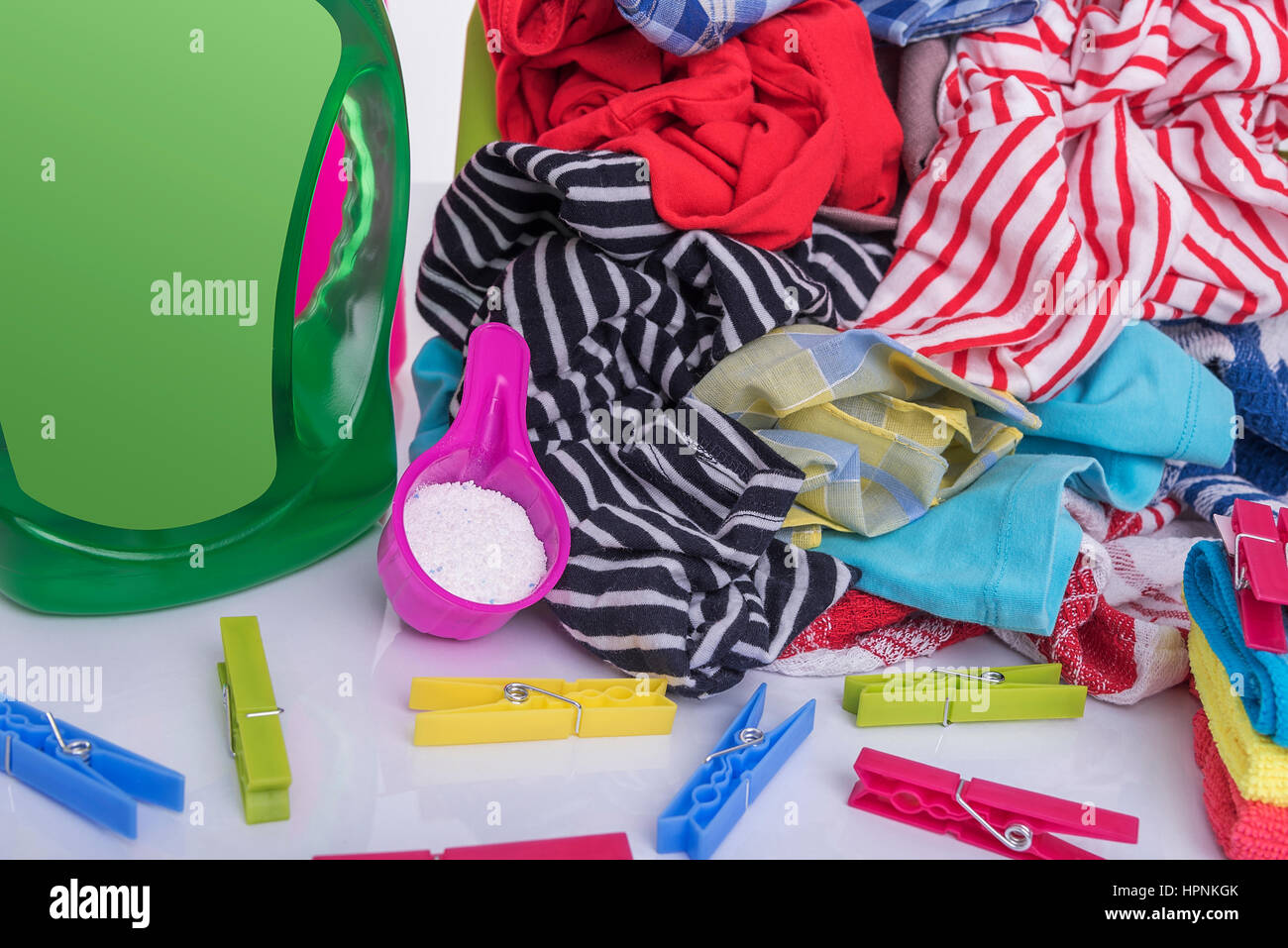 Dirty laundry and washing powder. Preparing the wash cycle Stock Photo ...